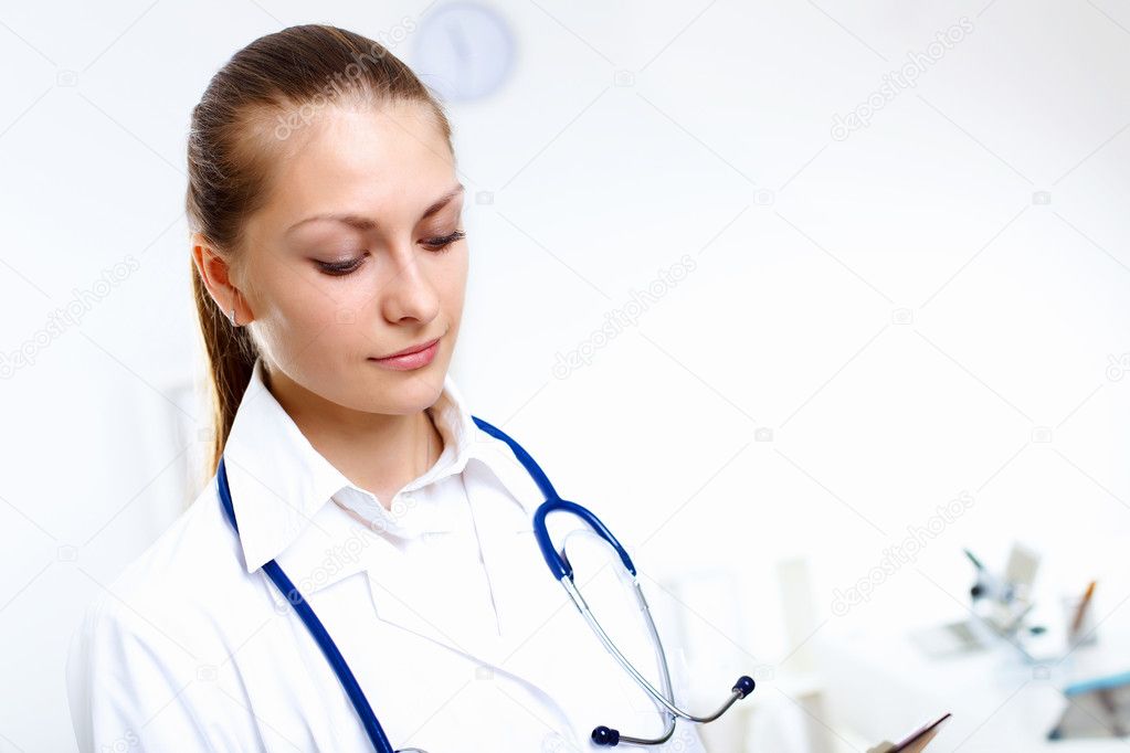 Friendly doctor in medical office Stock Photo by ©SergeyNivens 10129375