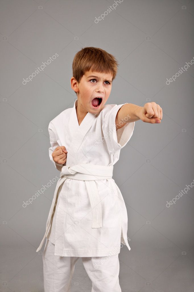 Karate boy in white kimono fighting Stock Photo by ©bloodua 8889674