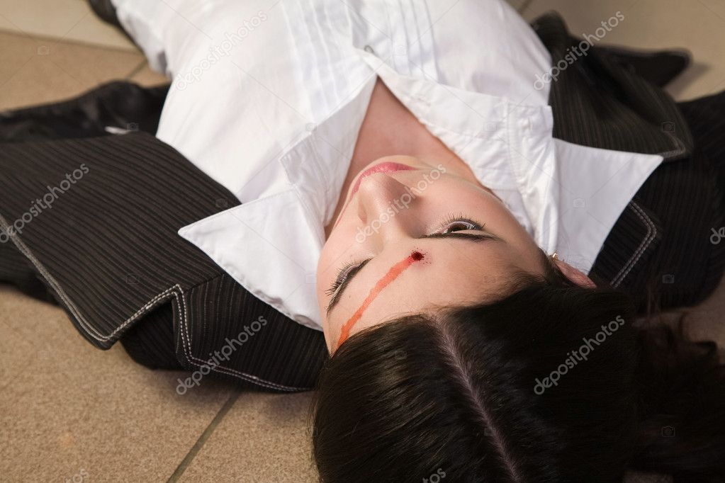 Lifeless businesswoman in a office Stock Photo by ©Demian 9616532