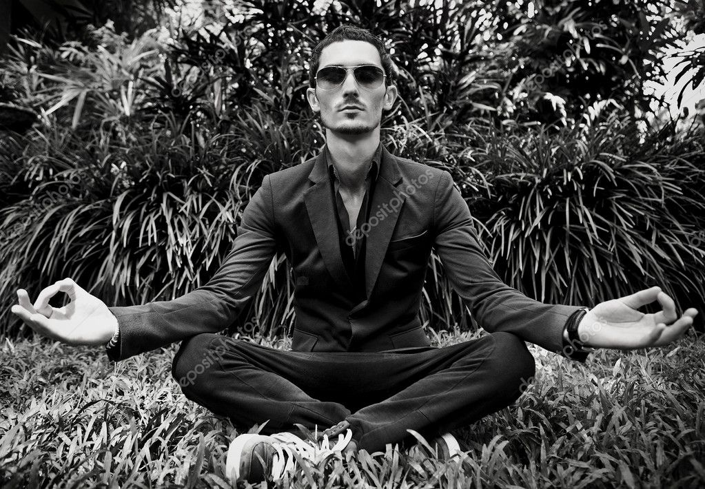 Close-up portrait of a good looking beautiful young man in costume ...
