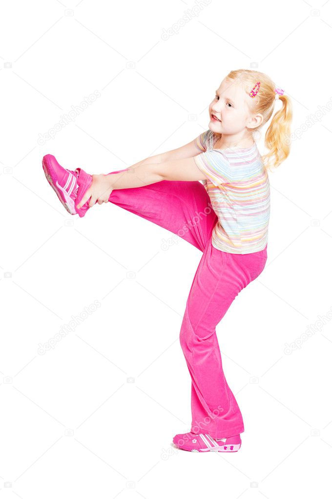 Little girl stretching studio isolated on white background Stock Photo ...