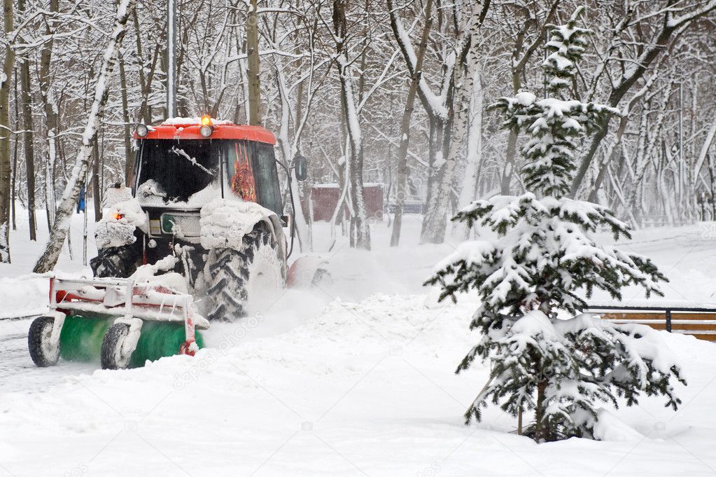 Small tractor snow removal Stock Photo by ©Garry518 8434987