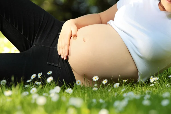 Beautiful belly of young pregnant woman — Stock Photo © Yaruta #21384583