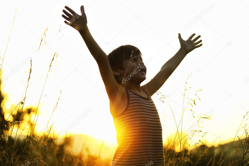 Happy kid enjoying in nature at sunset — Stock Photo © zurijeta #10421448