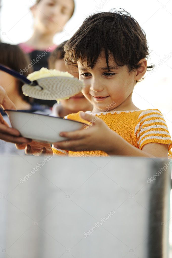 Hungry children in refugee camp, distribution of humanitarian food ...