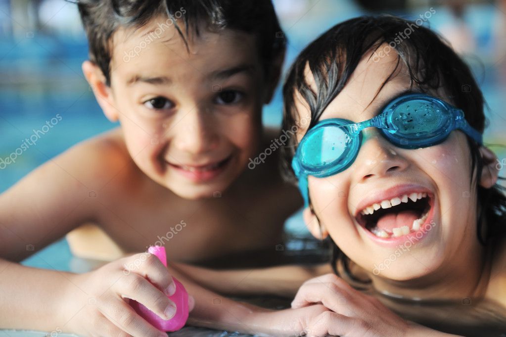 Summertime and swimming activities for happy children on the pool ...