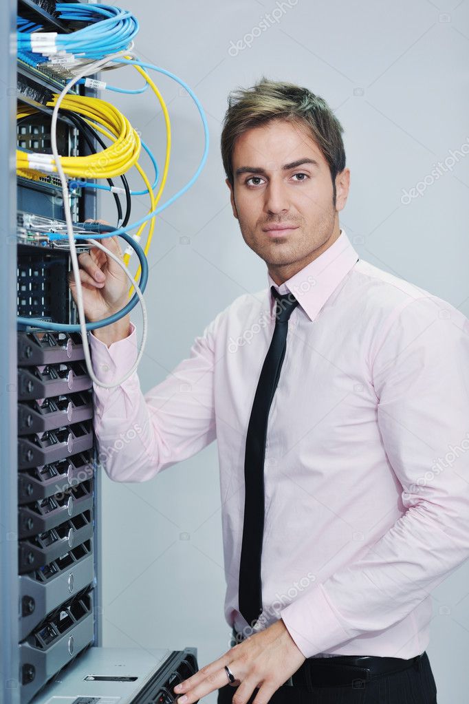Young it engeneer in datacenter server room — Stock Photo © .shock #8338606