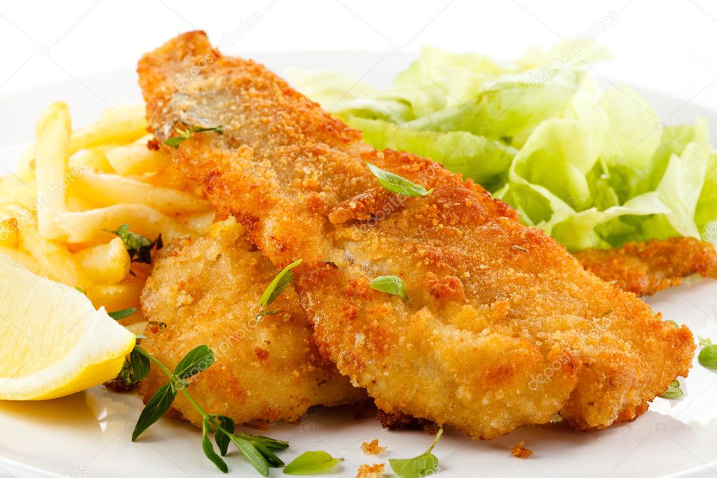 Fish dish - fried fish fillet, French fries with vegetables — Stock ...