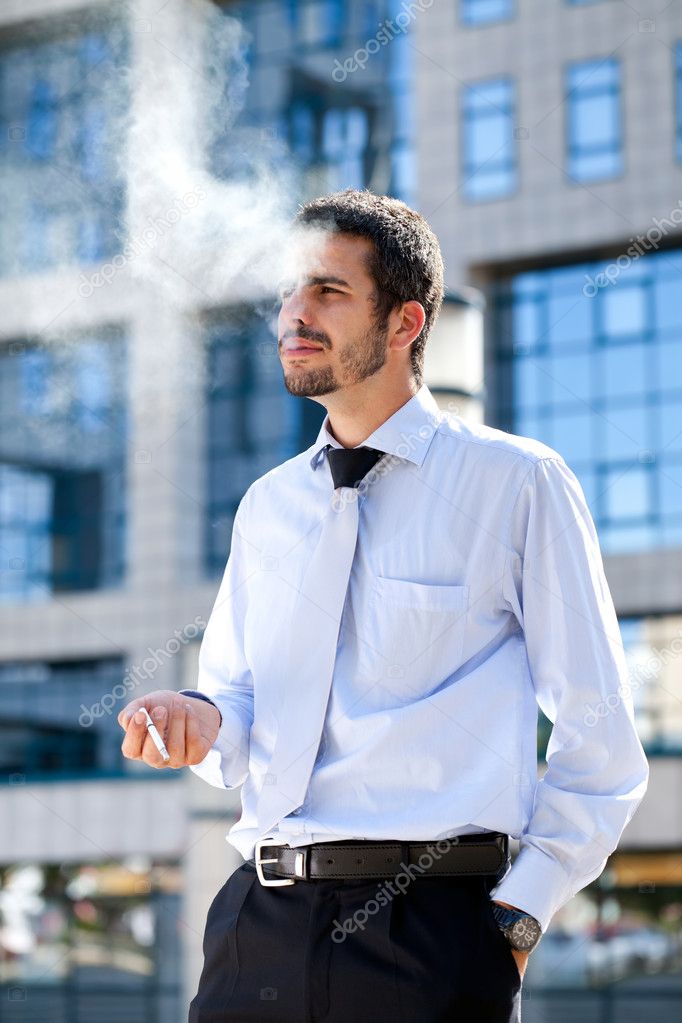 Businessman smoking — Stock Photo © luckybusiness #10634678