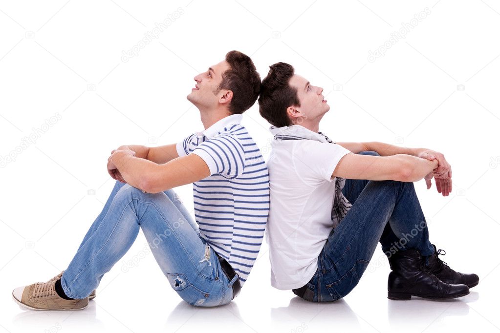 Two young casual men sitting back to back — Stock Photo © feedough #9445392