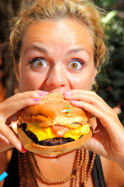 Girl eating cheeseburger Stock Photos, Royalty Free Girl eating ...