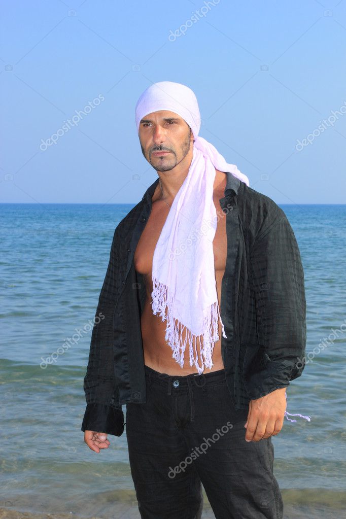 Handsome man by the sea Stock Photo by ©netfalls 8358611