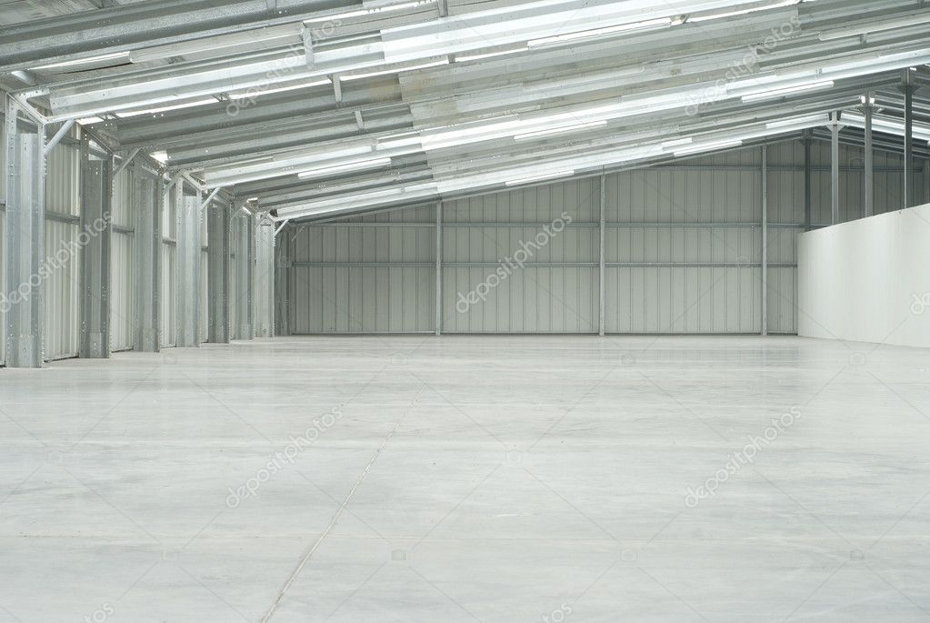 Half of a huge empty warehouse Stock Photo by ©Stefanov 8675349