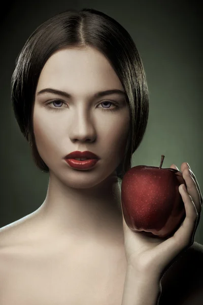 Portrait of caucasian young woman with apple - Stock Image - Everypixel