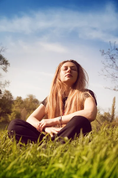 Calm woman relaxing in sunny grass field - Stock Image - Everypixel
