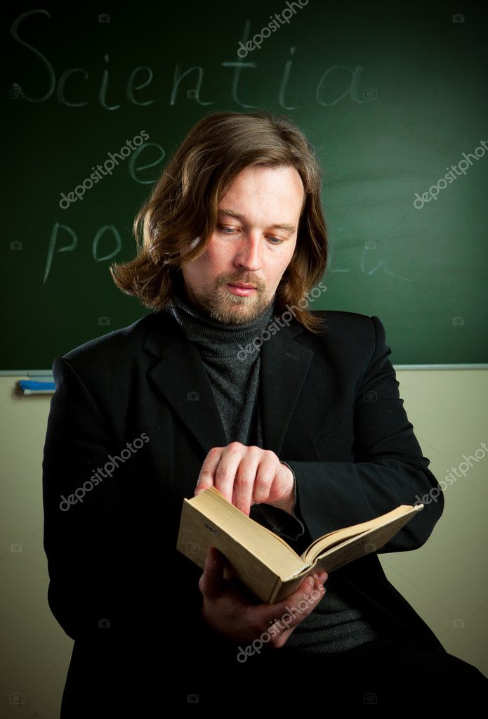 Professor reading a book Stock Photo by ©nikkytok 10242263