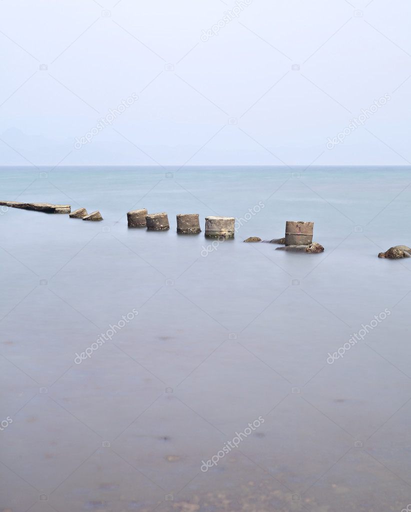 Broken stone bridge on sea — Stock Photo © leungchopan #8265327