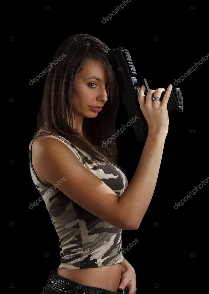 Girl holding gun — Stock Photo © grafvision #9203950