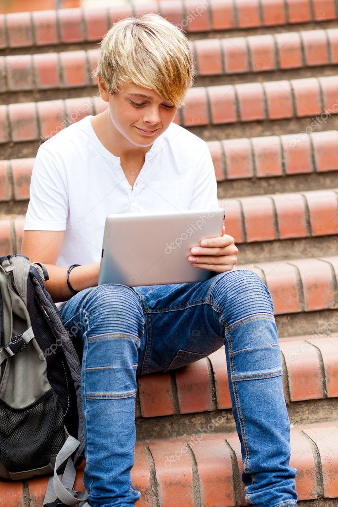 Teen boy using tablet computer Stock Photo by ©michaeljung 10675998