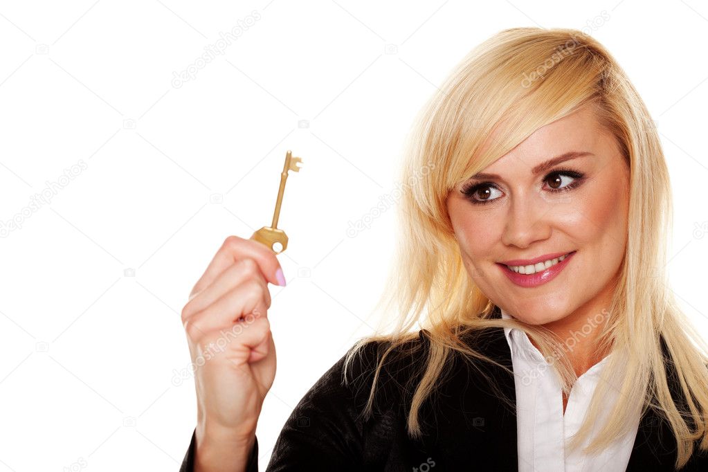 Successful woman holding brass key — Stock Photo © nelka7812 #10628552