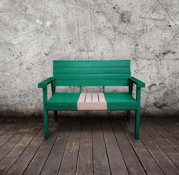 Green wooden chair in a grunge room - Stock Image - Everypixel