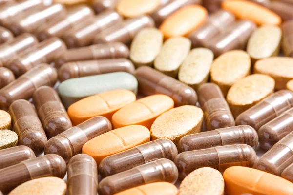 Medicinal pills piled up a bunch Stock Photo by ©apopium 7918968