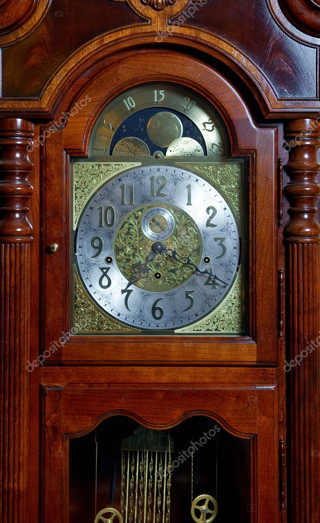 Wooden old-fashioned clock Stock Photo by ©amoklv 10216576