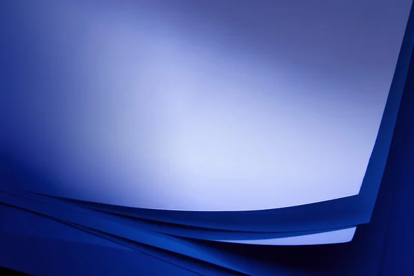 Art stack of blue paper in the dark lighting beacon of light - Stock ...
