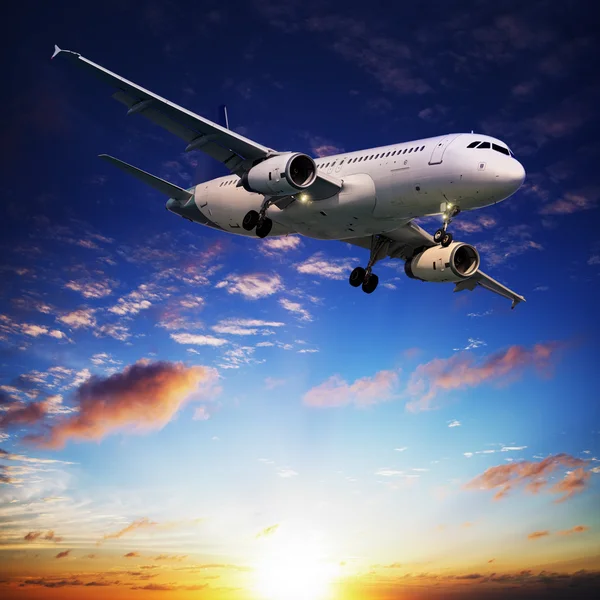 Jet plane in a sunset sky - Stock Image - Everypixel