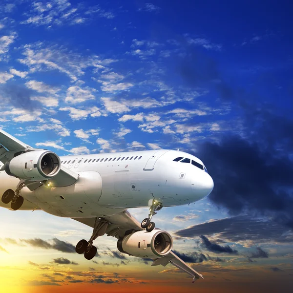 Jet plane in a sunset sky — Stock Photo © vladmoses #8647351