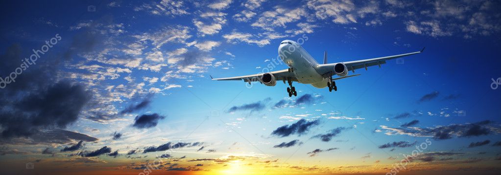 Jet plane in a sunset sky — Stock Photo © vladmoses #8647351