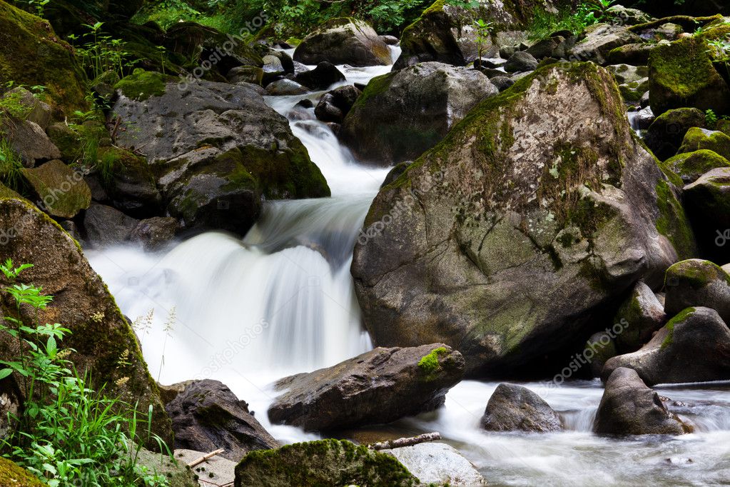 Stream in the mountains with water and stones Stock Photo by ...