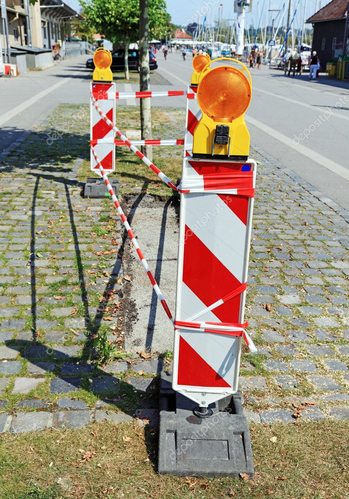 Road signs with flashers informing about some danger during pave Stock ...