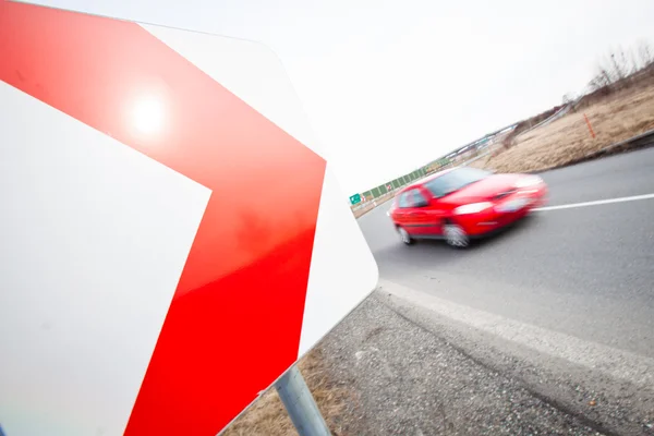 Traffic concept: car driving fast through a sharp turn - Stock Image ...