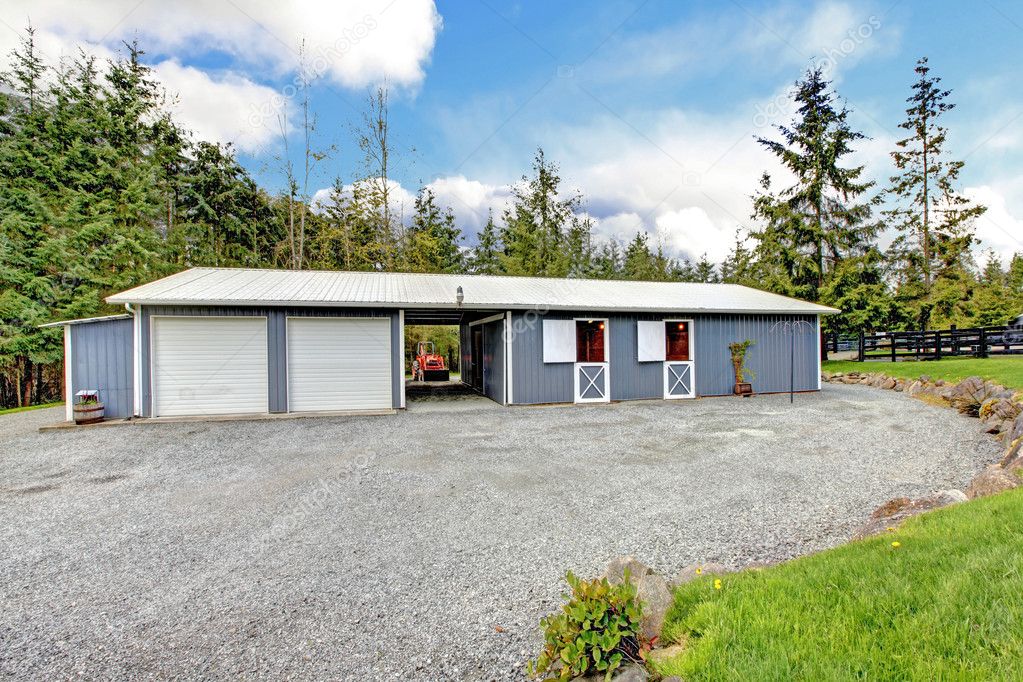 Horse farm stable buidling with horses and garage. — Stock Photo ...