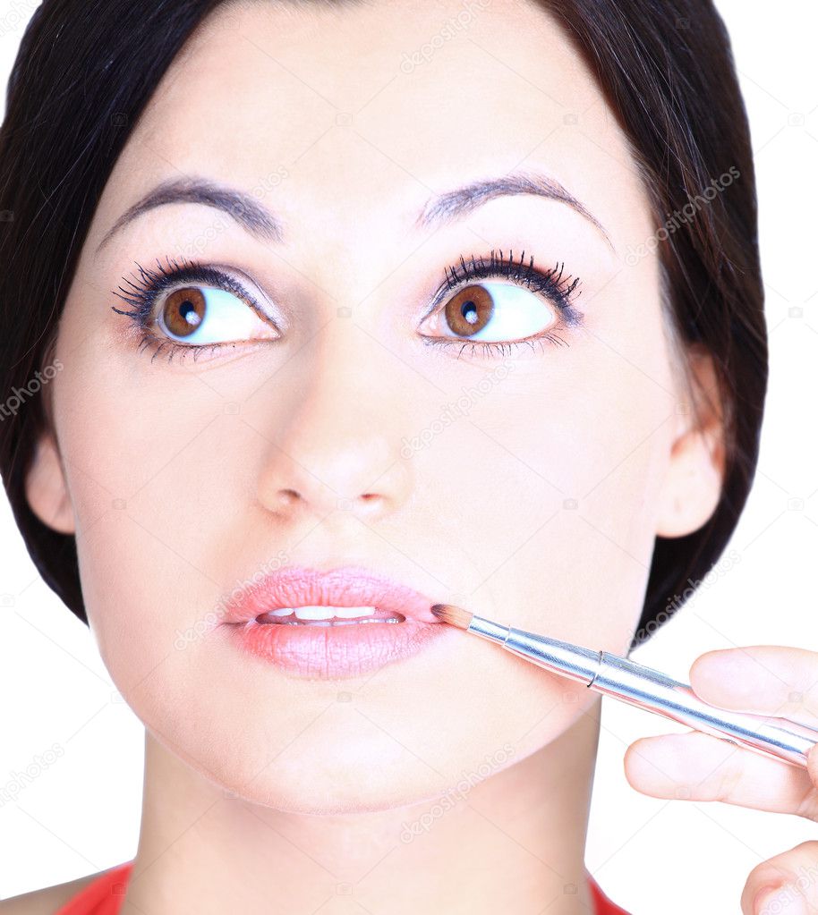 Close-up of gorgeous female face having visage made at beautician ...