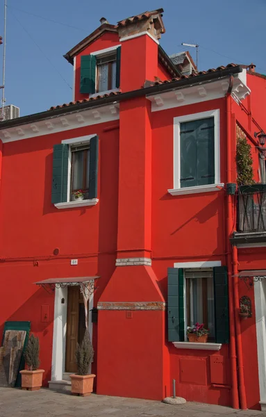 Bright red house on the island of Burano — Stock Photo © oroch2 #7301917