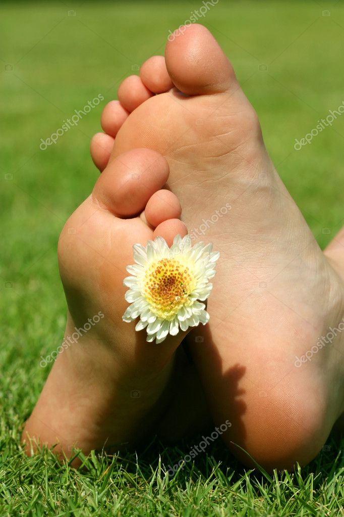 Feet and the flower Stock Photo by ©altanaka 9338258
