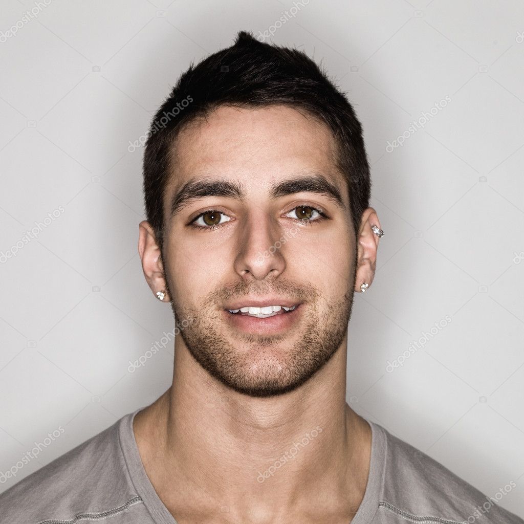 Headshot of a young man. Studio shot over grey. — Stock Photo © nickp37 ...
