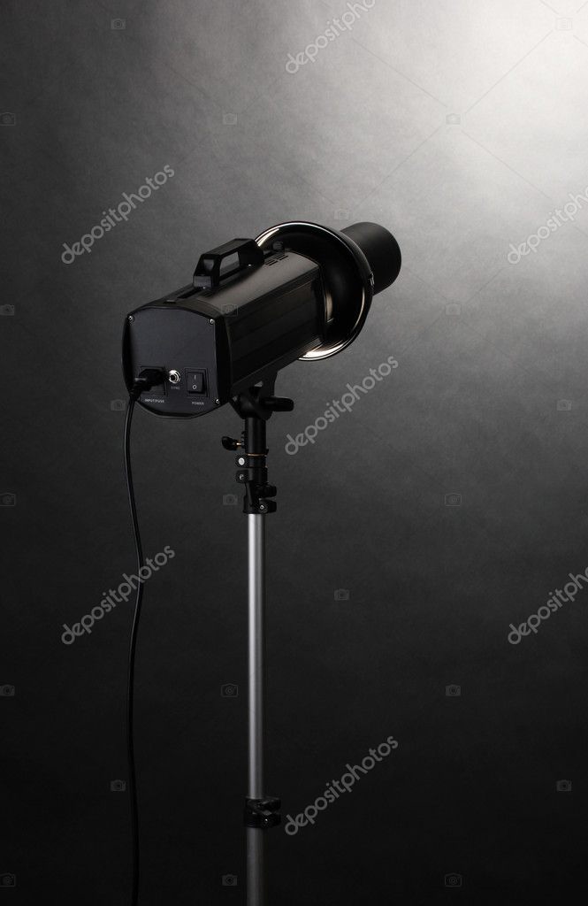 Studio flash on grey background — Stock Photo © belchonock #8121184