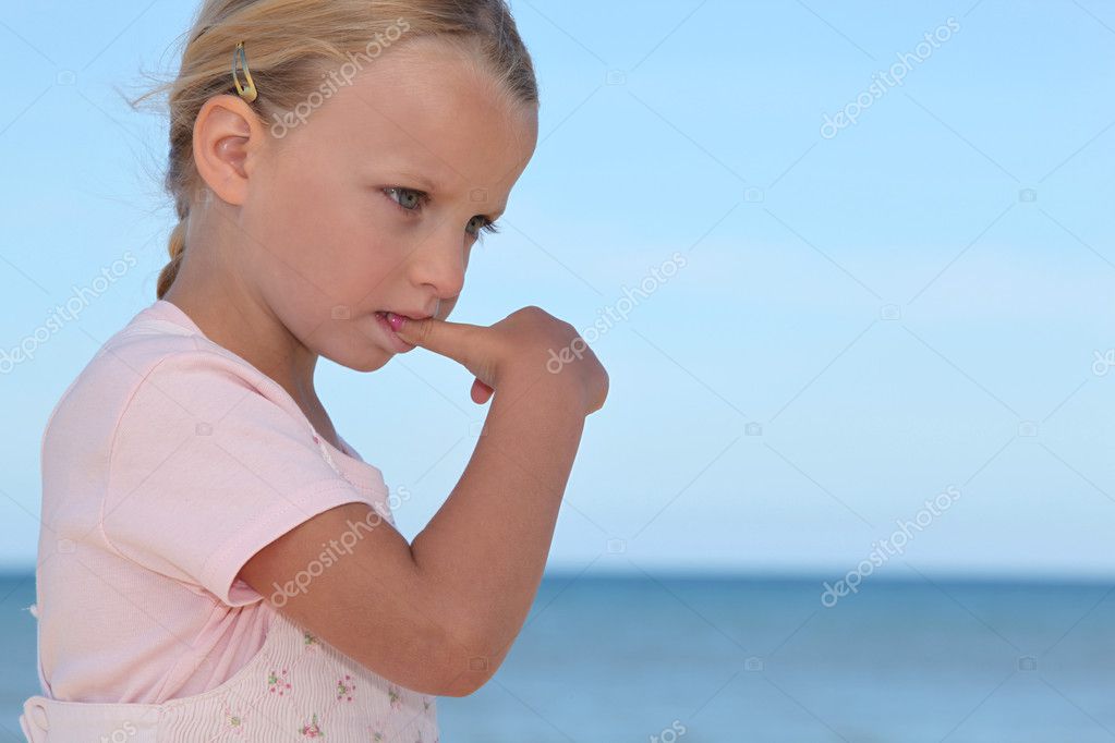 Young girl biting her thumbnail — Stock Photo © photography33 #8176869