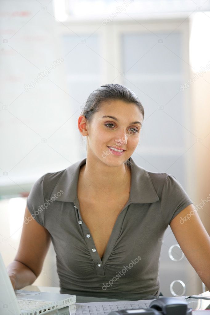 Casual office worker sat at her desk Stock Photo by ©photography33 8539430