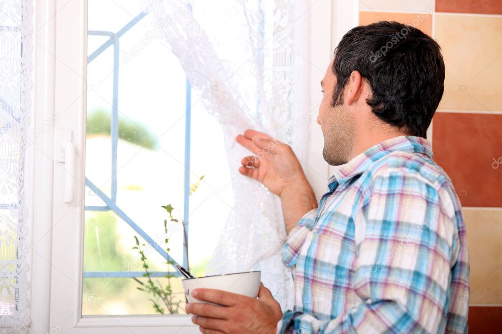 Man looking out window — Stock Photo © photography33 #8655503
