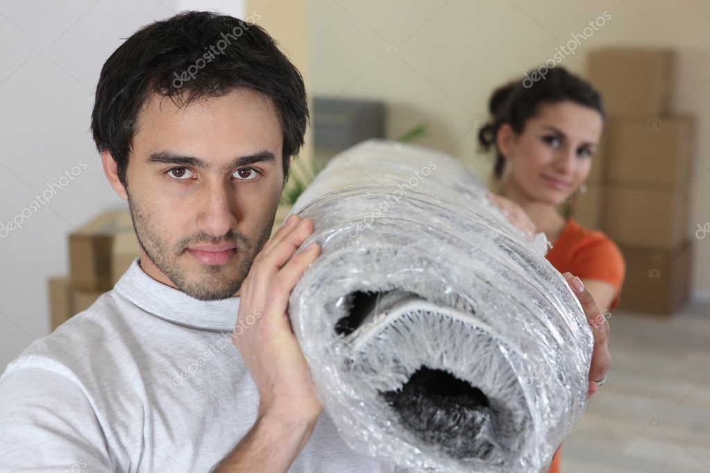Couple carrying a rug — Stock Photo © photography33 #8922342