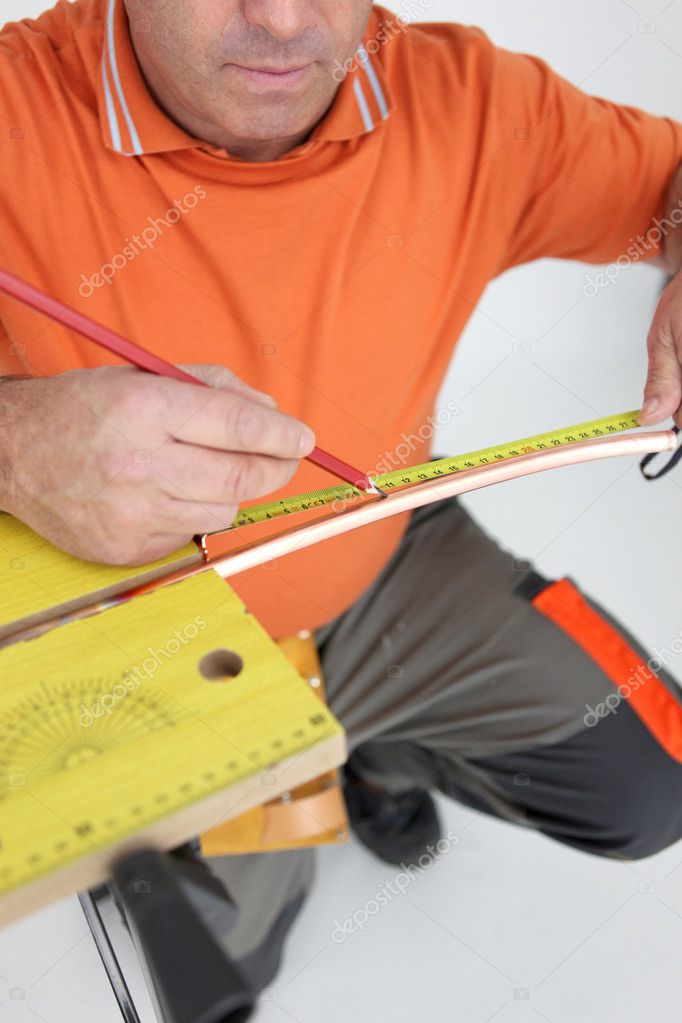 Worker using a tape measure Stock Photo by ©photography33 9953948