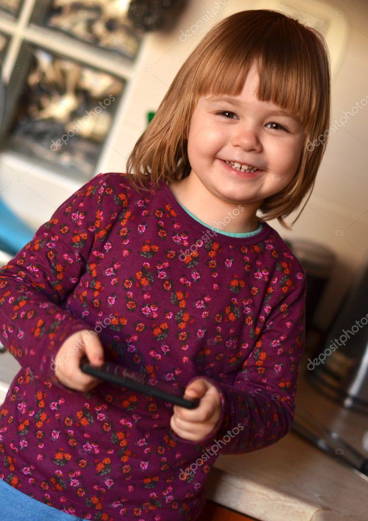 Little girl speaking by cell phone, white background Stock Photo by ...