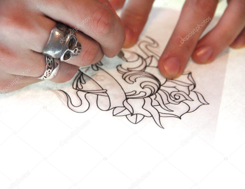 Tatto artist drawing sketch Stock Photo by ©destillat 10210514