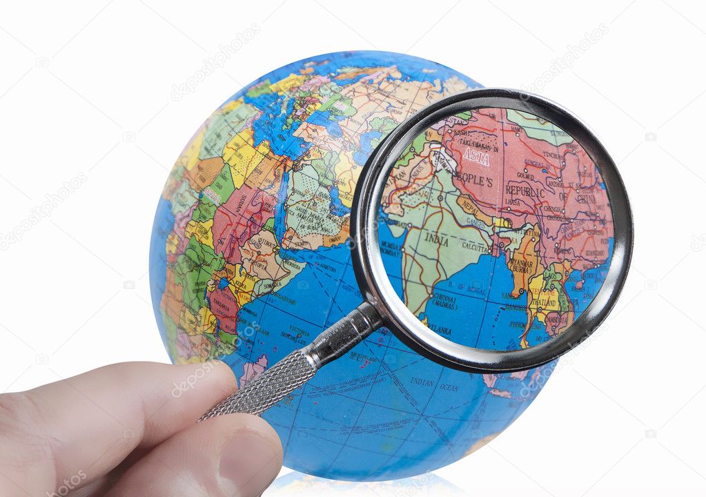 Terrestrial globe with magnifying glass — Stock Photo © R.Mendolo #9173834