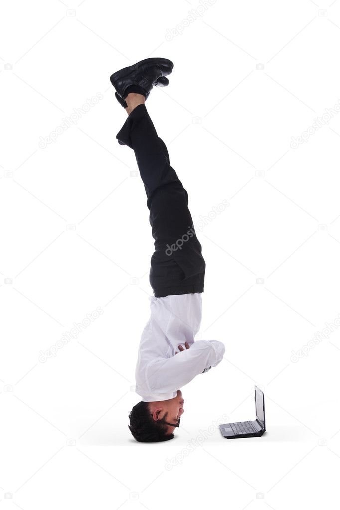 Isolated businessman headstand with laptop Stock Photo by ©realinemedia ...