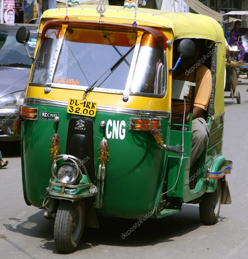 Auto rickshaw driving on road, delhi, india – Stock Editorial Photo ...